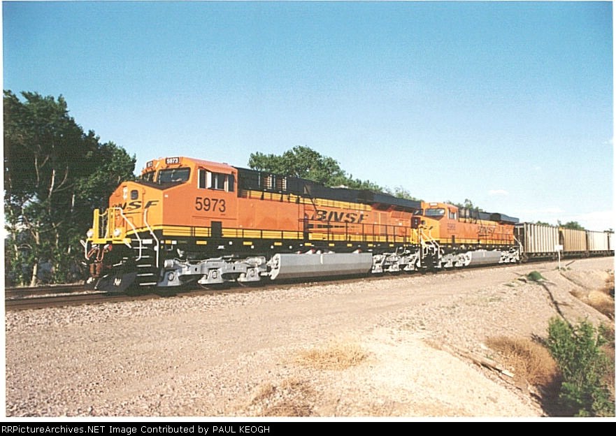 Almost out of Amarillo, Tx; BNSF 5973 and BNSF 5968 roll past me on their way to Pueblo, Co.